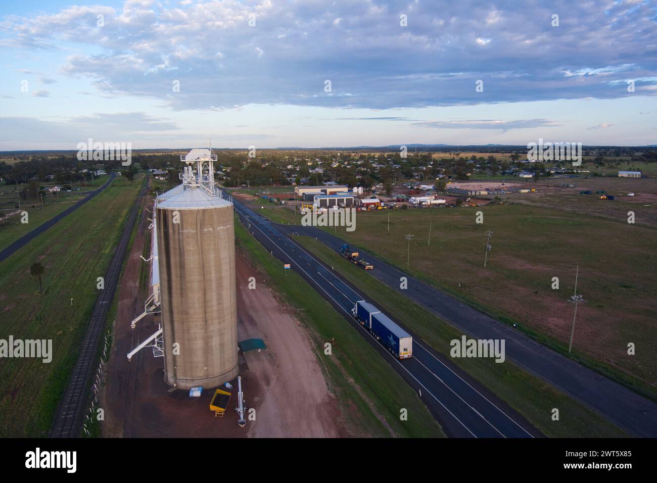 Aerial of Warrego Highway as it passes the Grain Silos at Wallumbilla ...