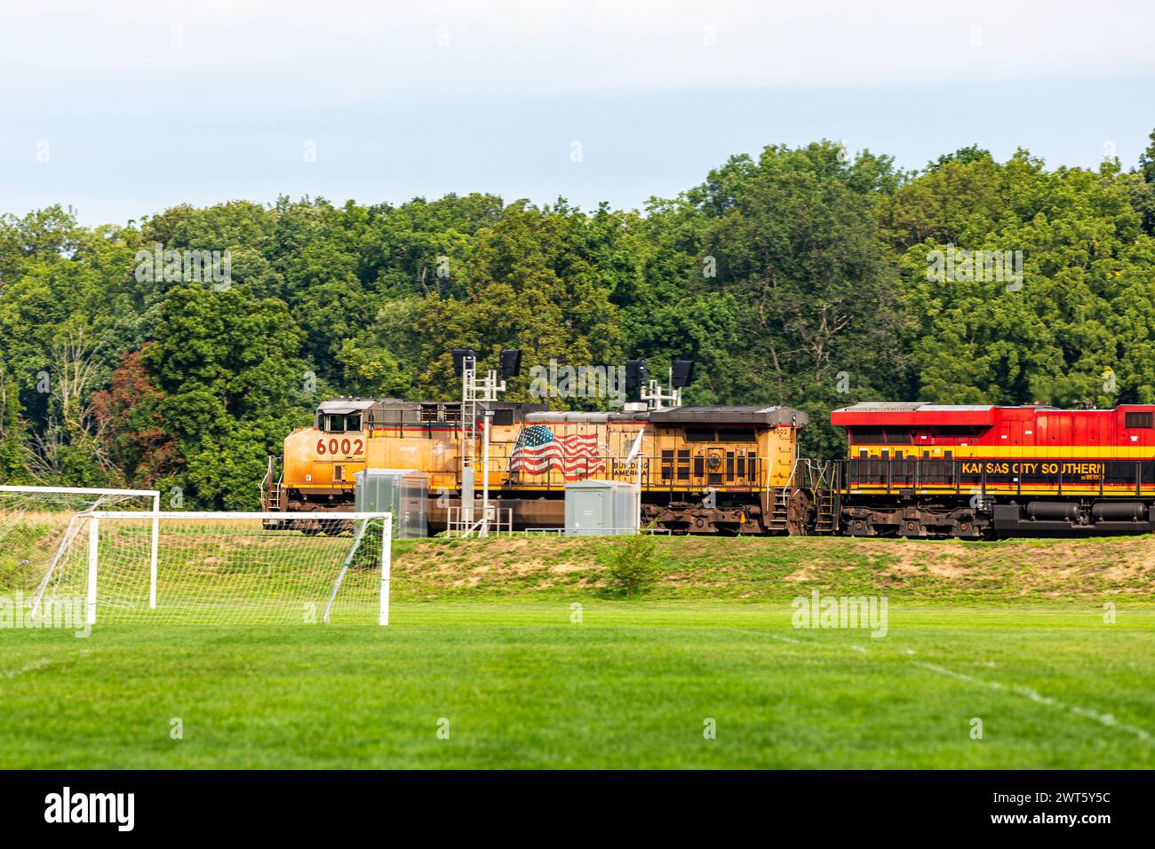 Union Pacific locomotive 6002 pulls a train past the soccer fields at ...