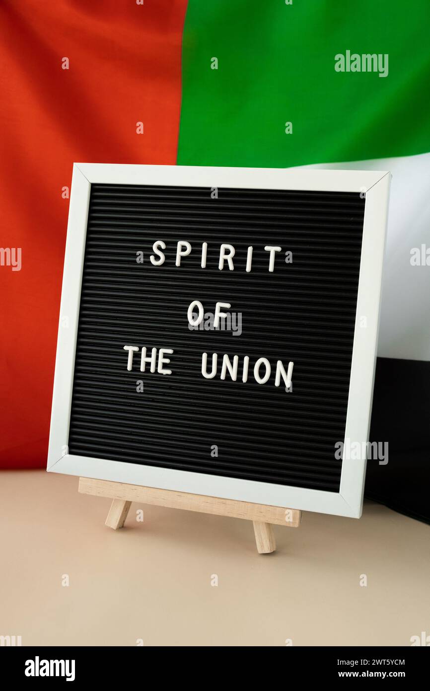 Text SPIRIT OF THE UNION on background flag of UAE. National holiday of ...