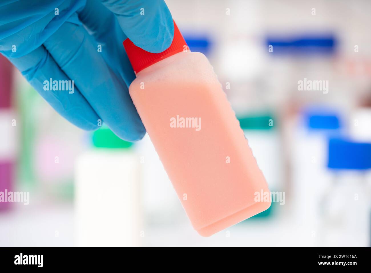 Plastic bottle with pink liquid. Plastic bottle with pink liquid in ...