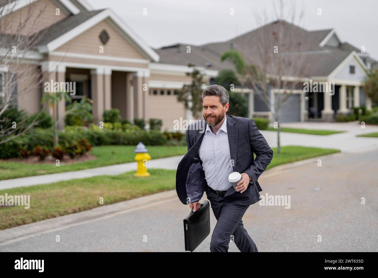 Business man run near house in american neighborhood. Businessman run ...