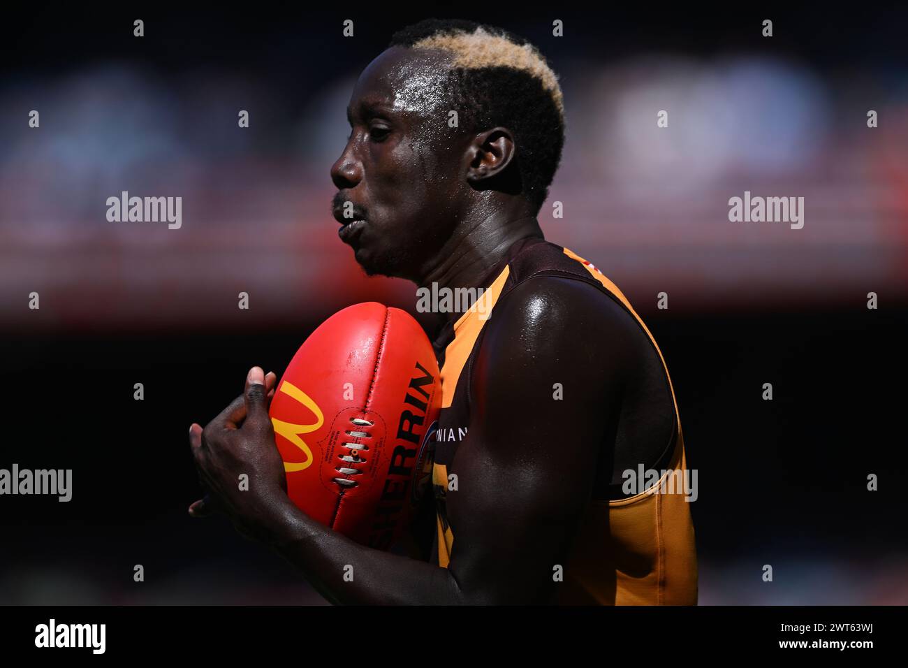 Melbourne, Australia. 16th Mar, 2024. Mabior Chol of the Hawks marks ...