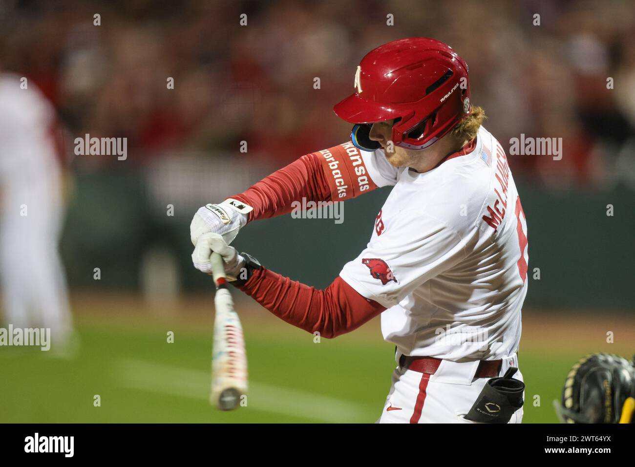 March 15, 2024: Ben McLaughlin #6 of Arkansas starts his swing while he ...