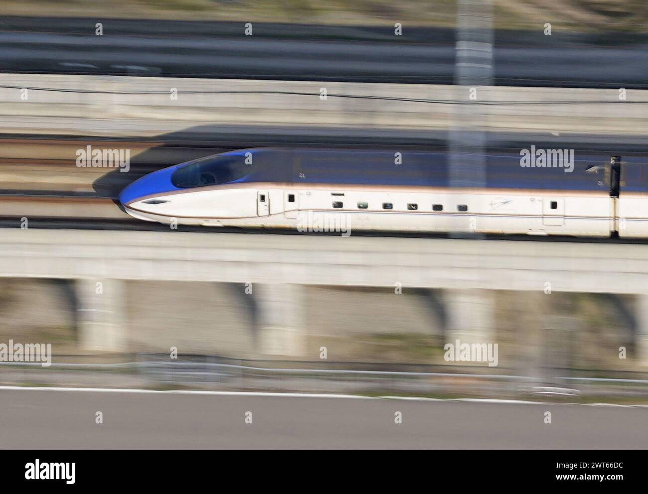 Photo taken from a Kyodo News helicopter on March 16, 2024, shows the first train bound for ...