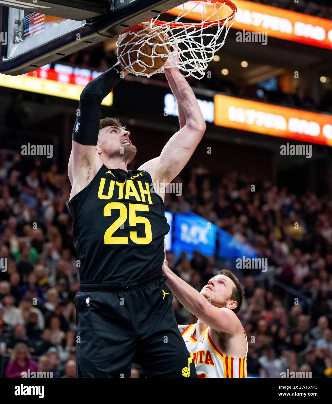 Utah Jazz center Micah Potter dunks over Atlanta Hawks guard Garrison ...