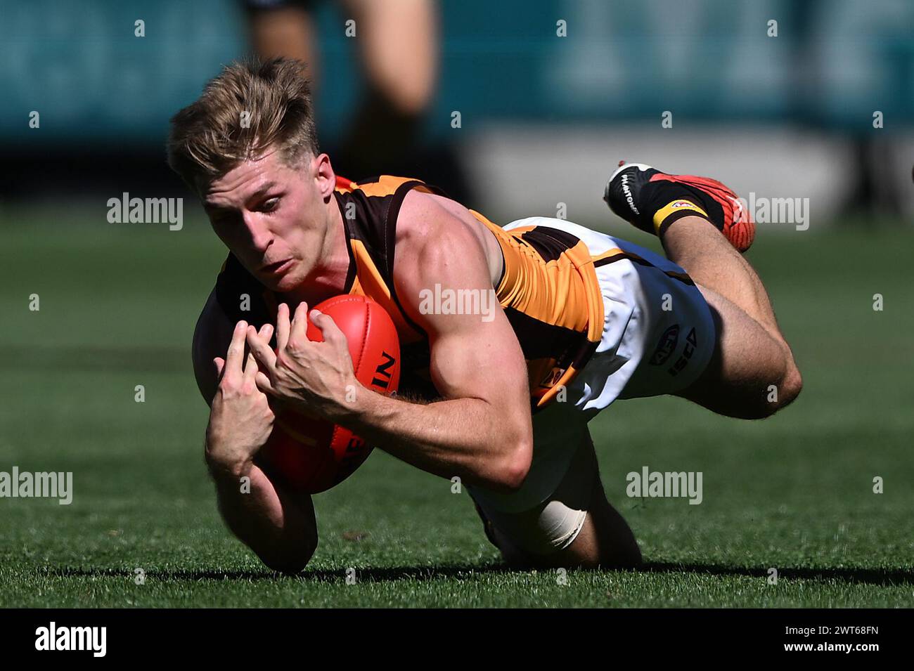 Melbourne, Australia. 16th Mar, 2024. Dylan Moore of the Hawks marks ...