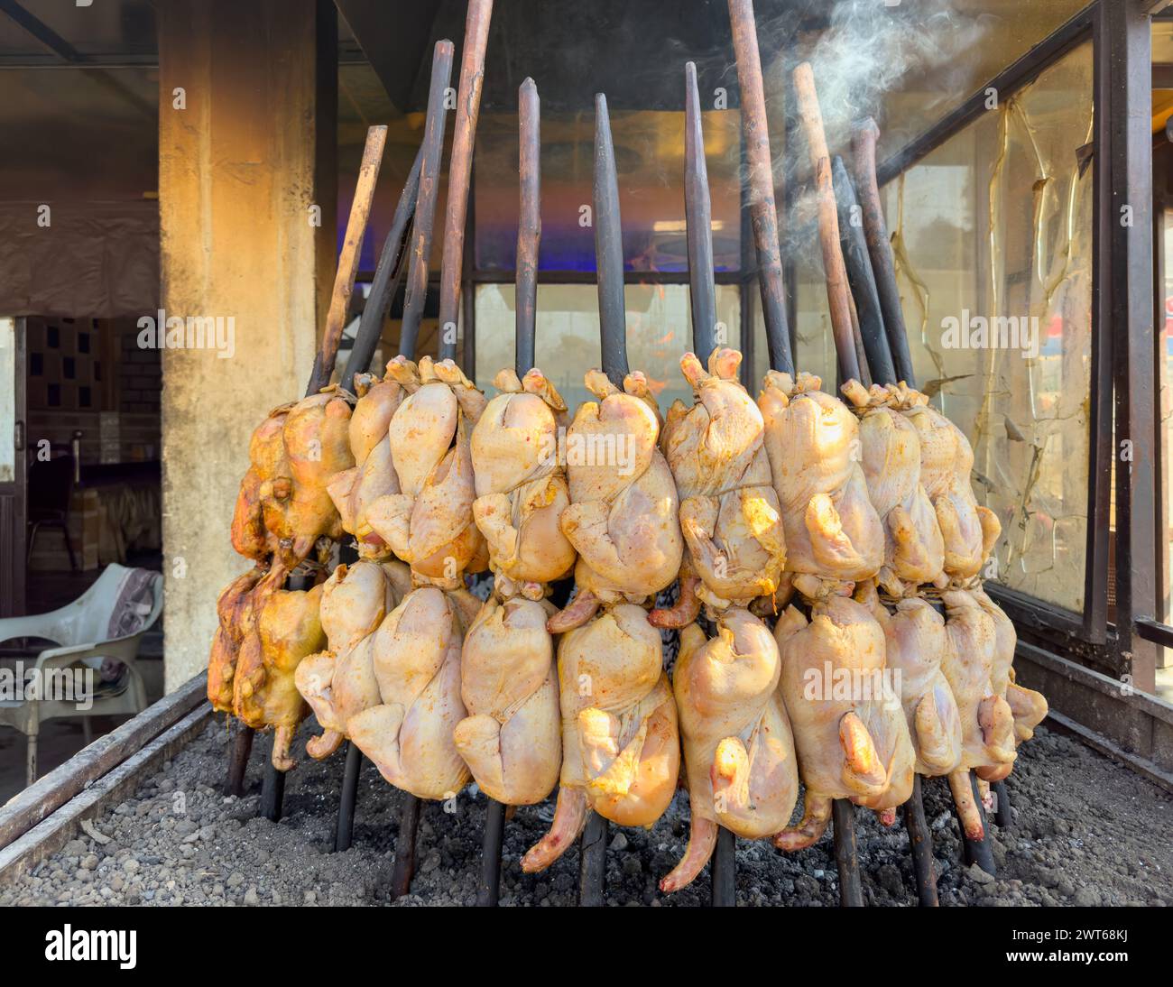 Traditional Balochi chicken sajji preparation in a local restaurant ...