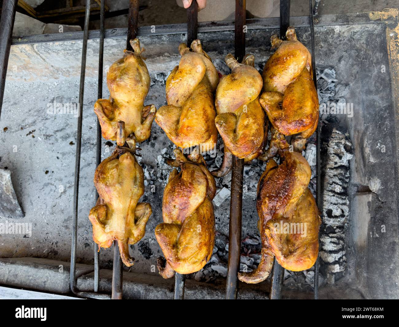 Balochi chicken sajji bar b que on charcoal Stock Photo - Alamy