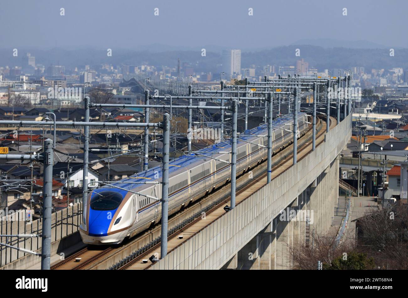 The Hokuriku Shinkansen runs in Hakusan City, Ishikawa Prefecture on ...