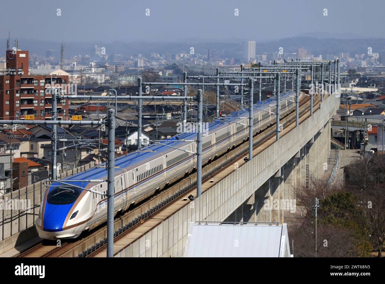 The Hokuriku Shinkansen runs in Hakusan City, Ishikawa Prefecture on ...