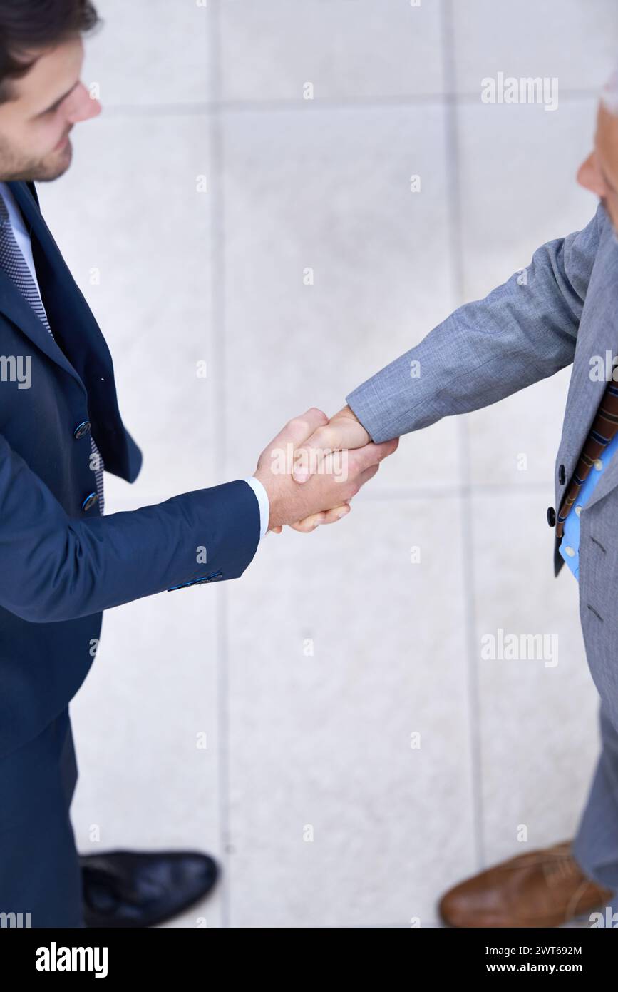 Above, business people and shaking hands for deal, collaboration or b2b ...
