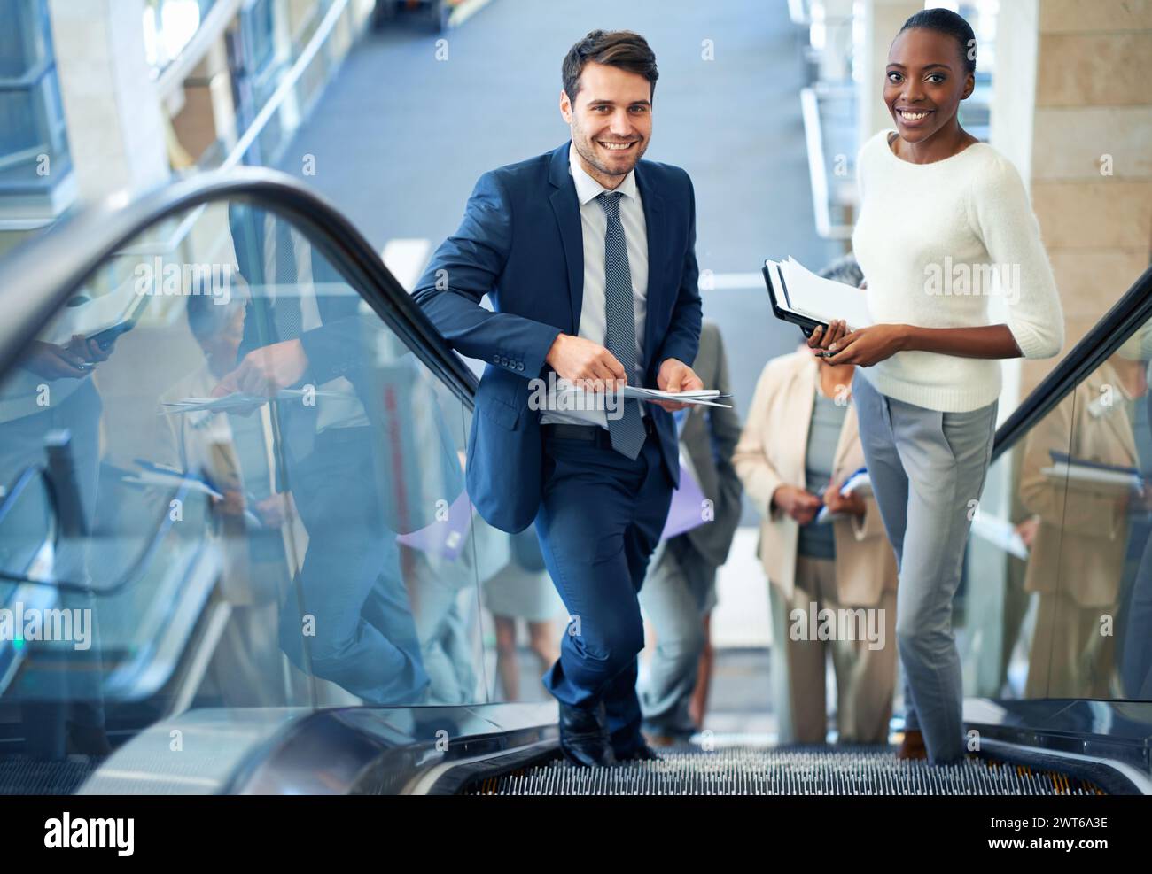 Teamwork, portrait or business people on escalator for meeting, travel ...