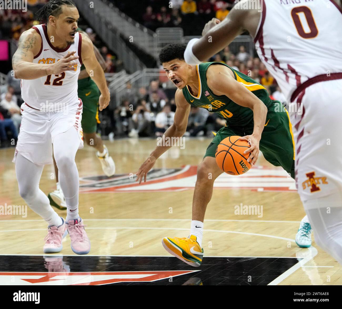 MAR 15 2024: Baylor Bears guard RayJ Dennis (10)drives between Iowa ...