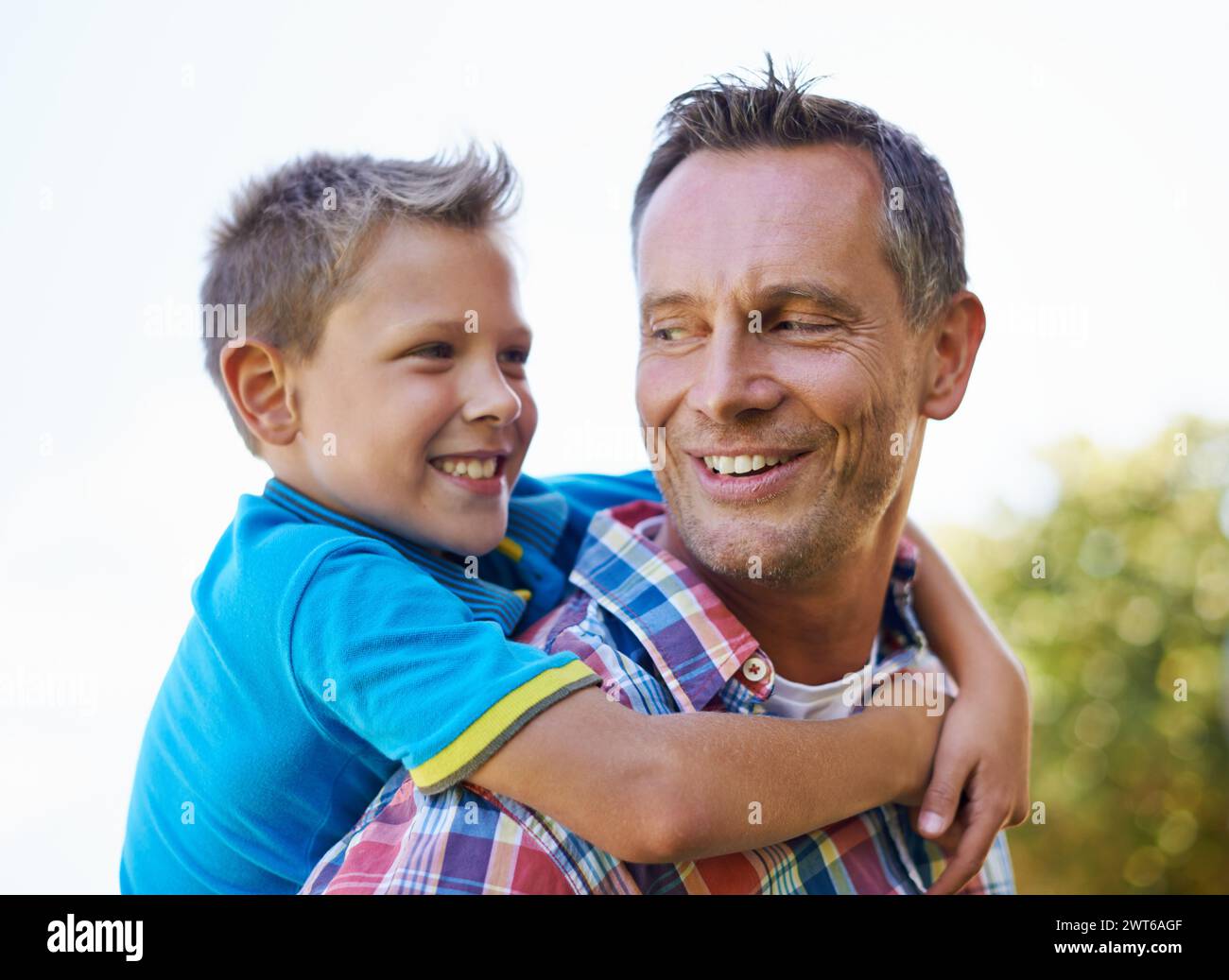 Piggyback, happiness and dad with kid to play outdoors for bonding ...