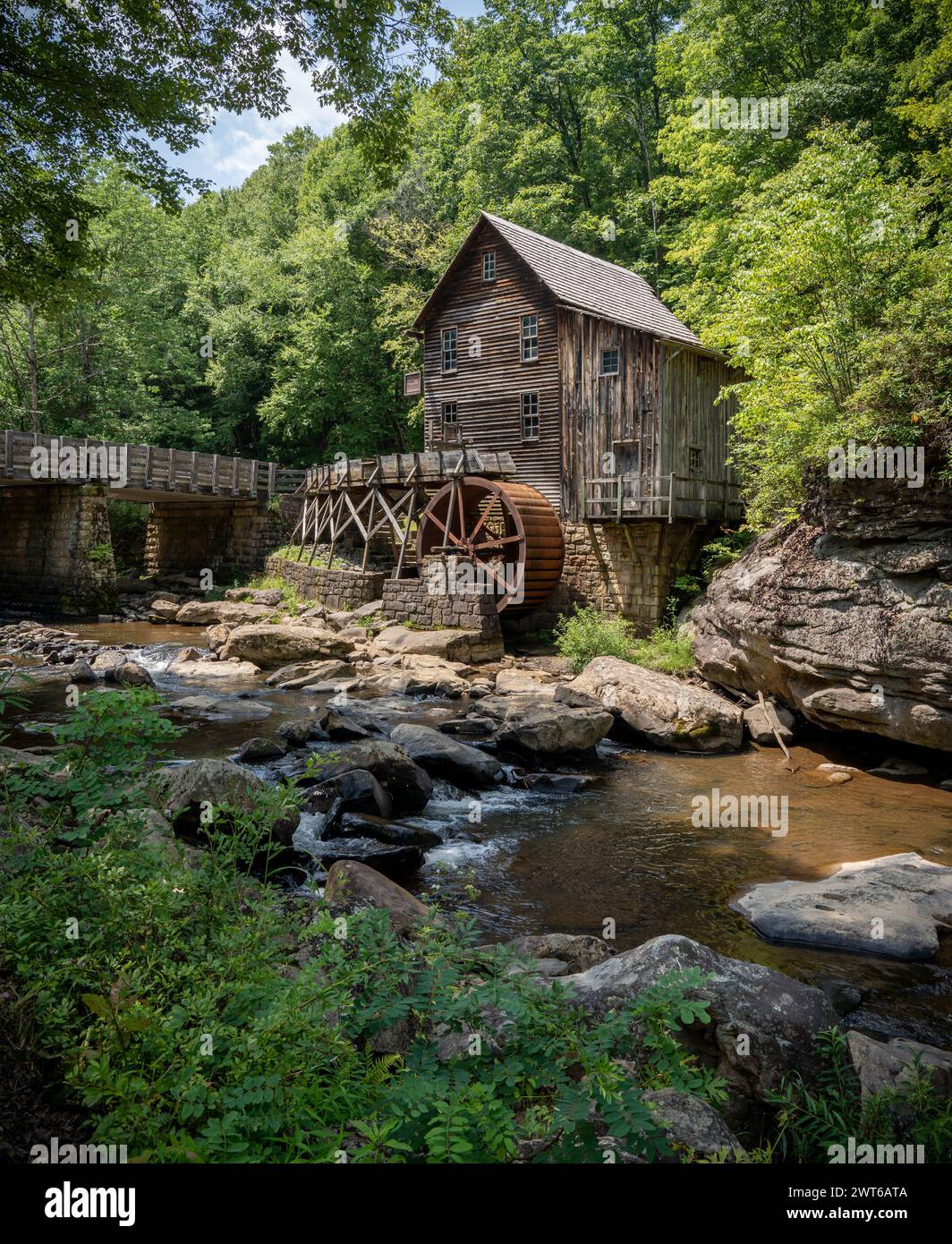 Rustic wooden structure by a forest water mill Stock Photo - Alamy