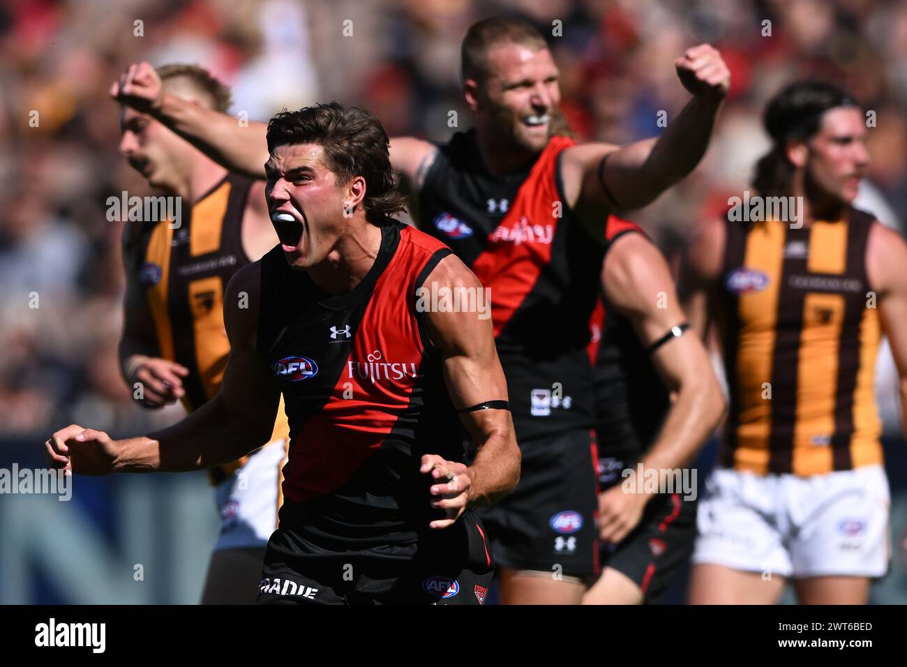 Melbourne, Australia. 16th Mar, 2024. Sam Durham of Essendon (left ...