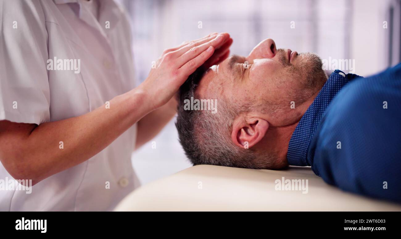 Reiki Therapy Alternative Healing Massage For Man Stock Photo - Alamy