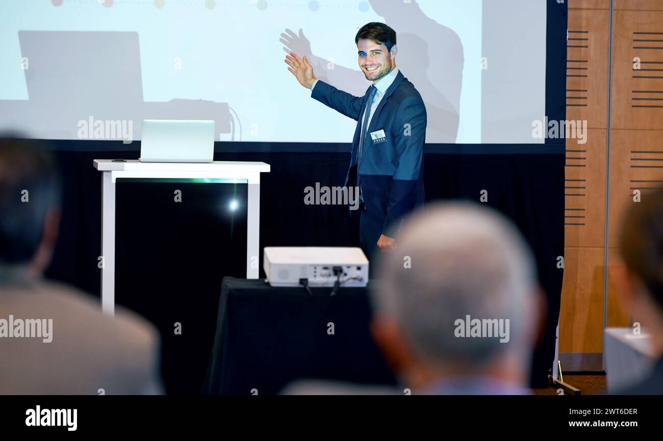 Business man, podium and presentation, point at projector screen at ...