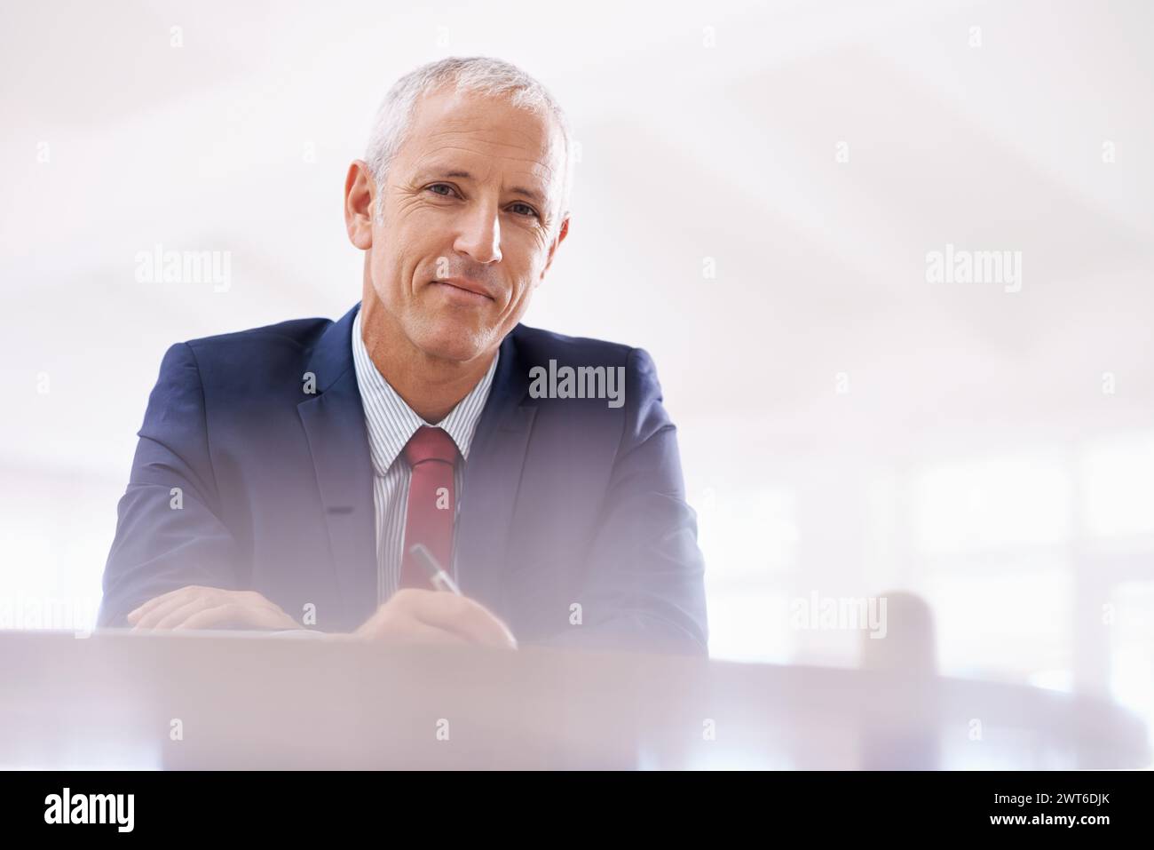 Business, portrait and senior man writing in office for planning ...
