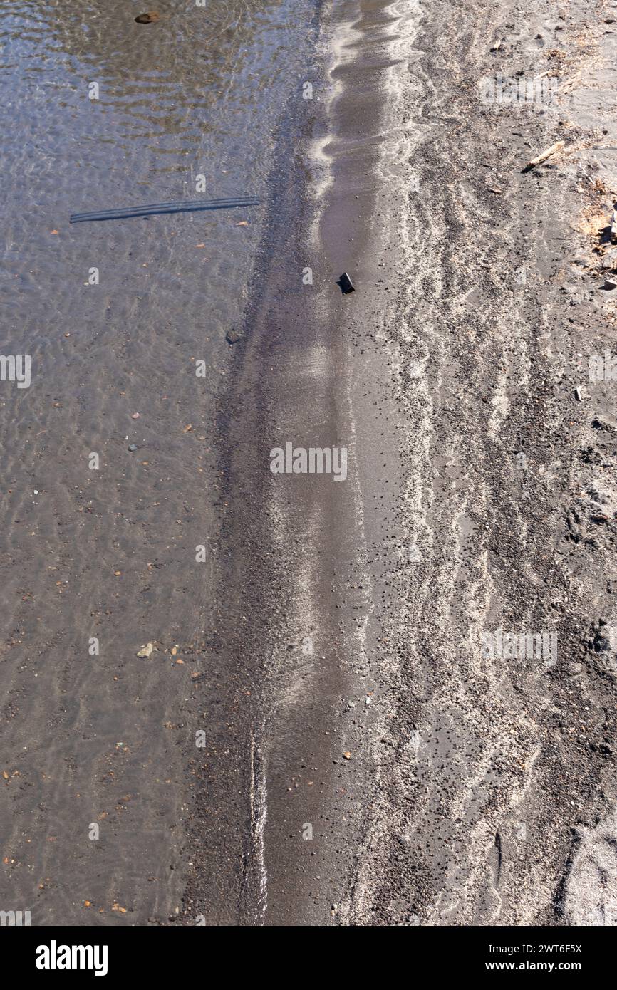 Photo of sand and dirt ground with marks of waves in the shore Stock ...
