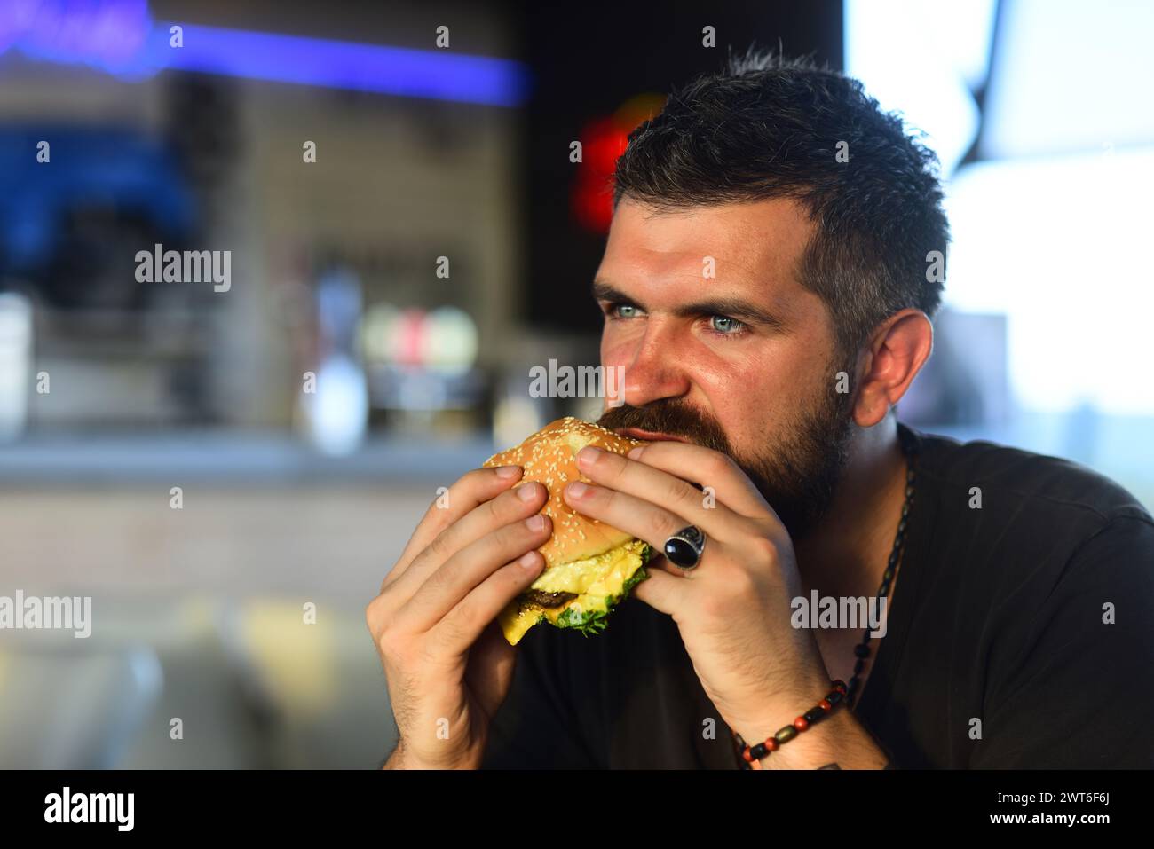 Hunger Man eat burger. Man eat tasty Hamburger. Dinner with Hamburger ...