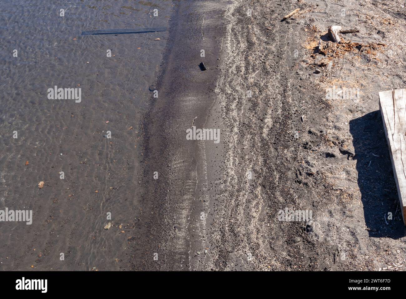 Photo of sand and dirt ground with marks of waves in the shore Stock ...