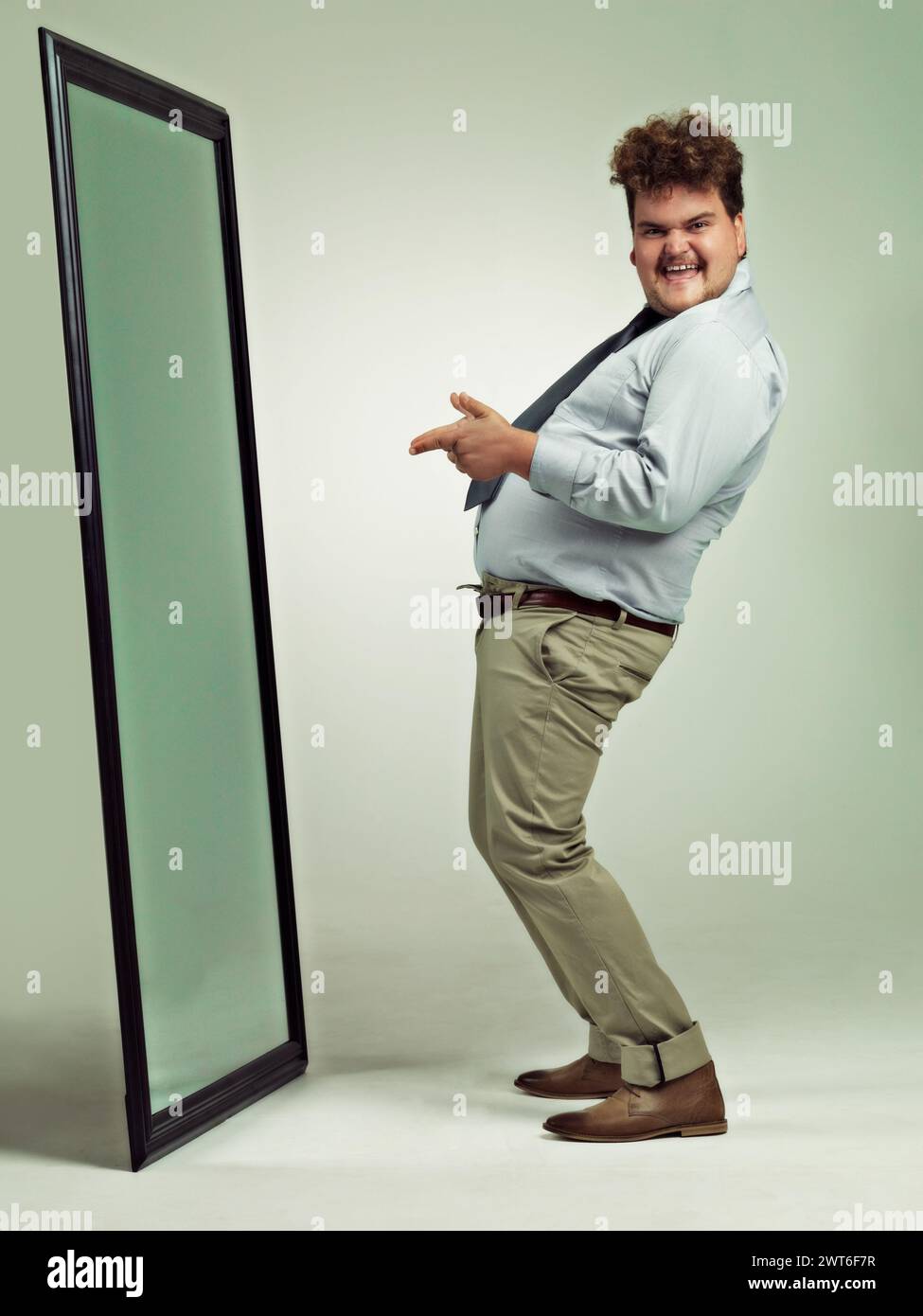 Mirror, portrait and man with happiness for pointing, excited and smile ...