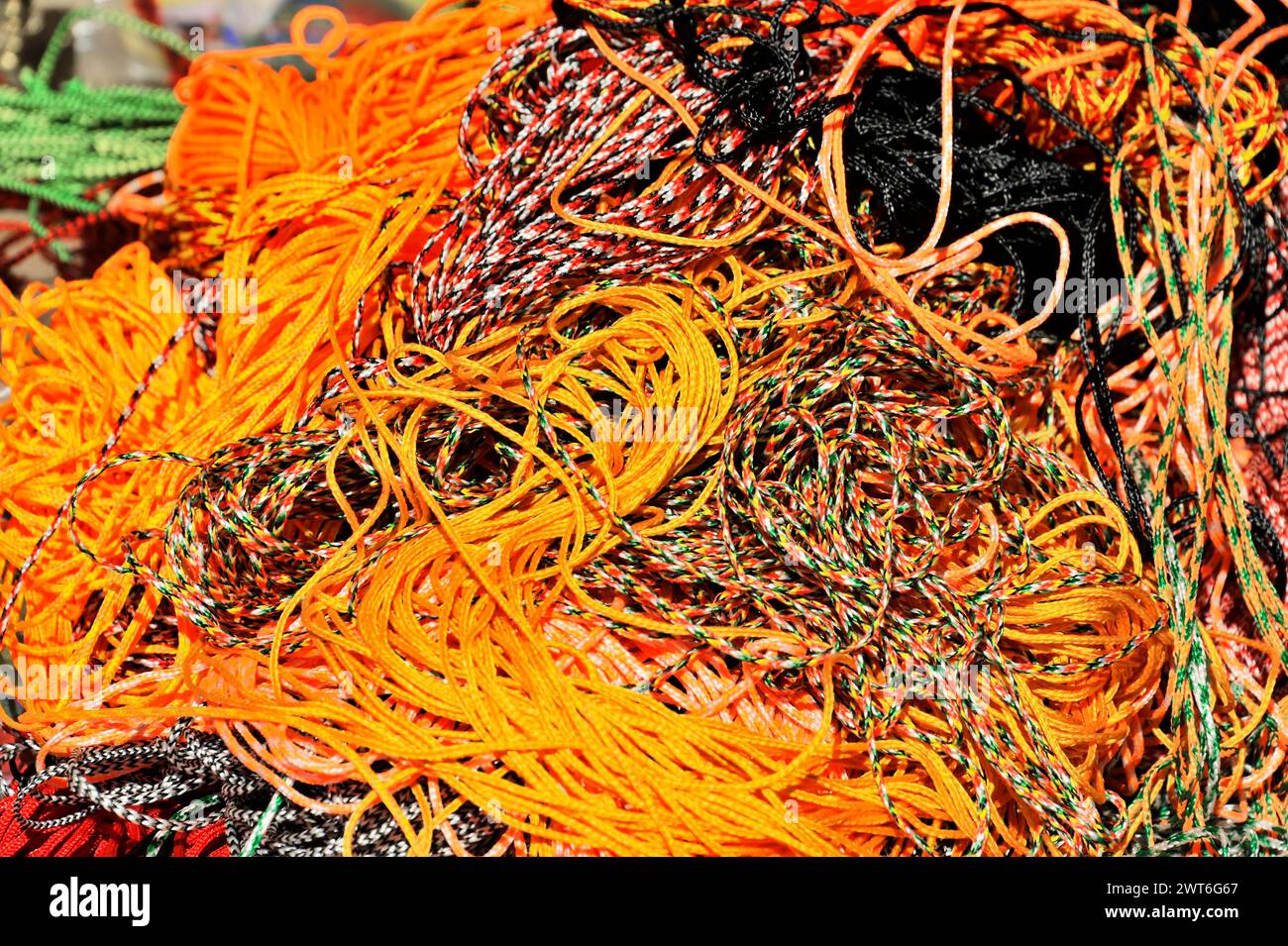 Tangled orange ropes laid out in a heap, Kathmandu Valley, Kathmandu ...