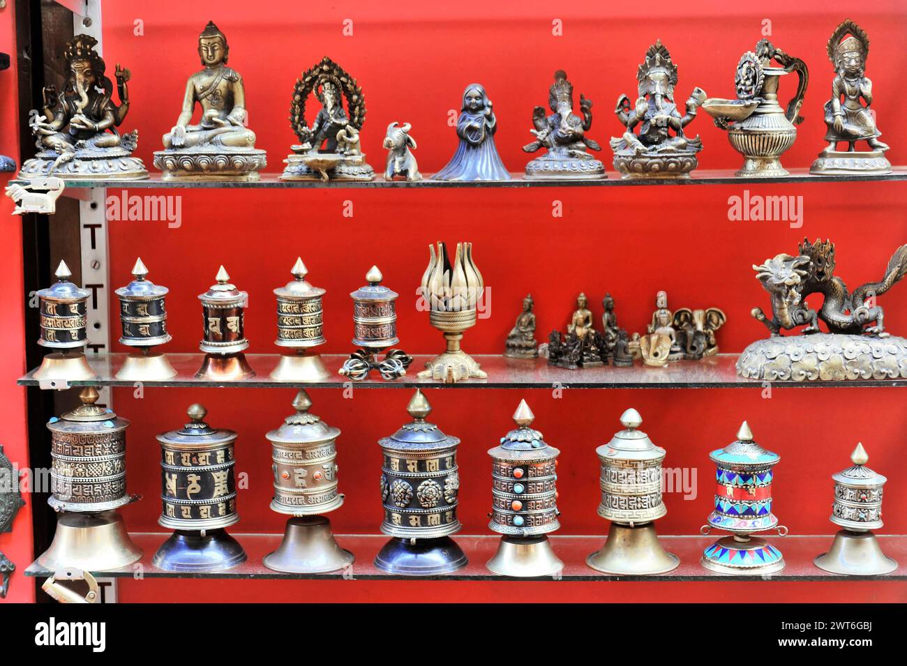 Display with religious figures and colourful mantra scrolls, Kathmandu ...