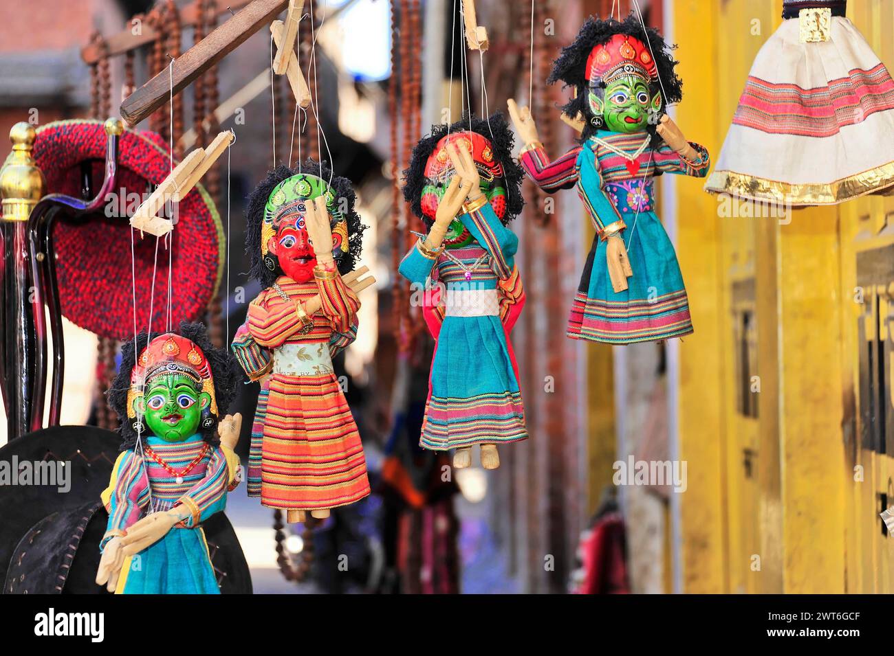 Puppets with colourful clothes hanging from a market stall, Kathmandu ...