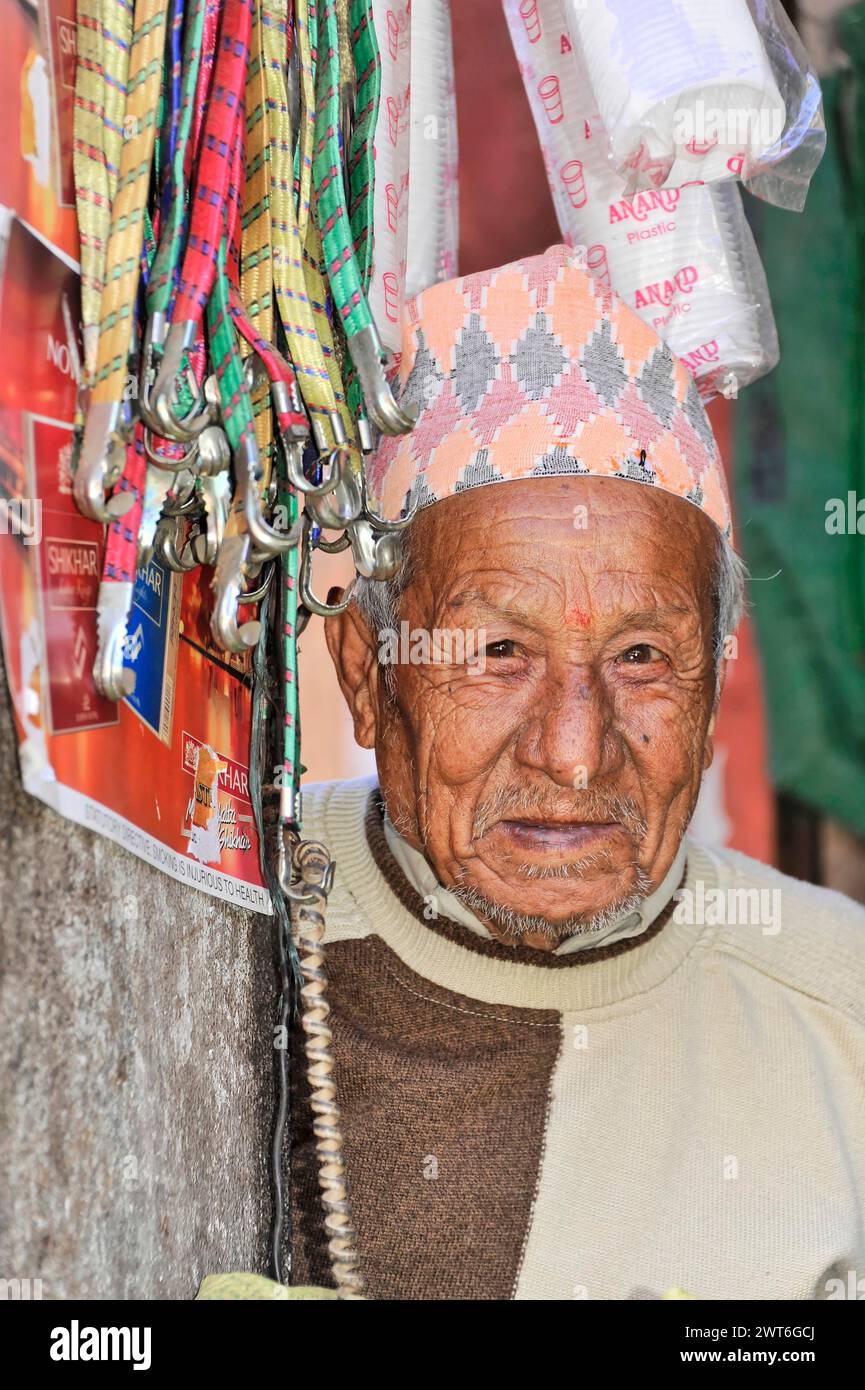 Portrait of a serious looking elderly man with traditional headgear ...