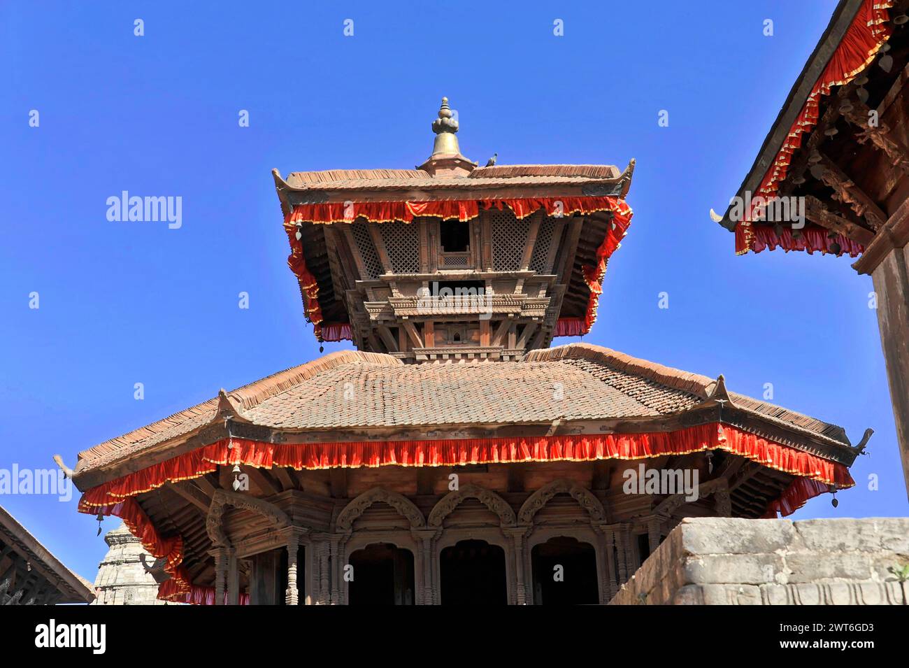An ancient Asian temple under a clear blue sky, Kathmandu valley ...