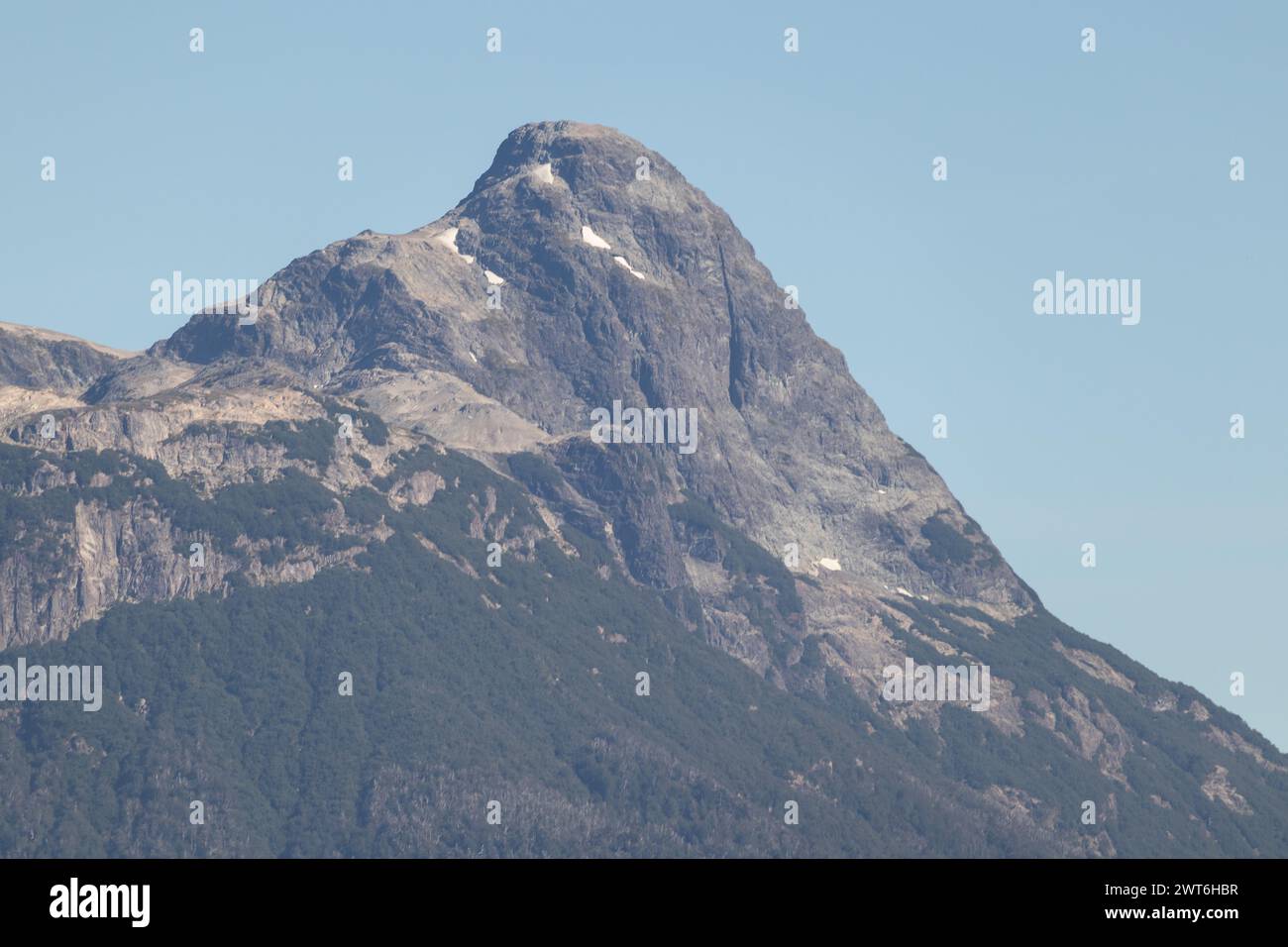 Lonely horizontal view of mountain peak with growing vegetation on the ...
