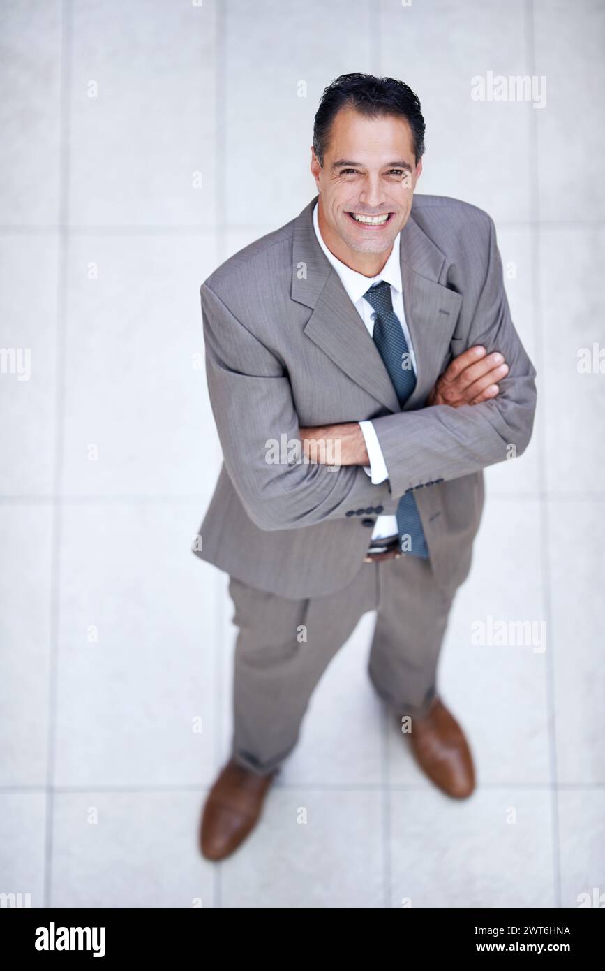 Happy, portrait and high angle of man in business or office with ...