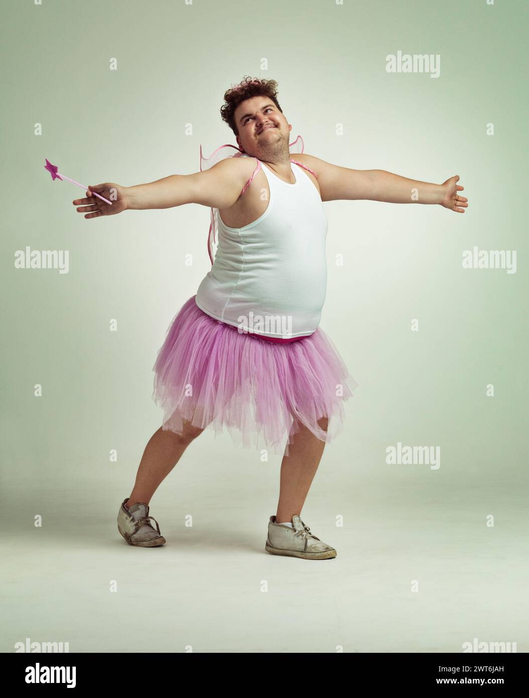 Fairy, man and studio for magic and isolated, happy male person with ...