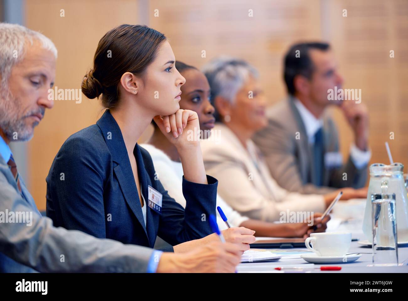 Boardroom, listening and employees with notes in meeting for business ...