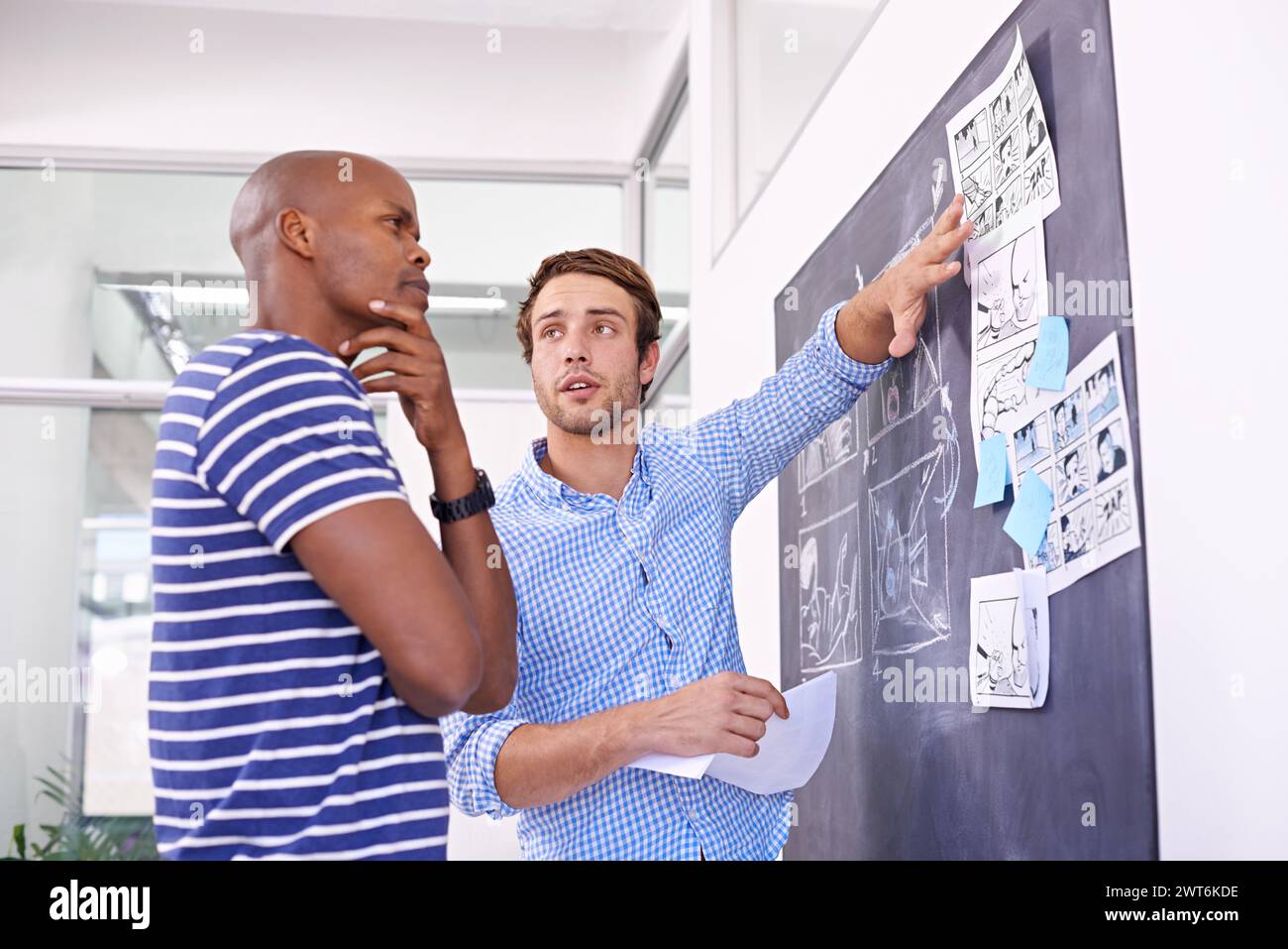 Business people, planning and creative by chalkboard in office for ...