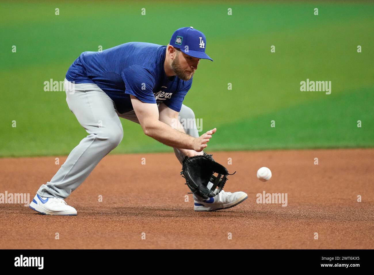Los Angeles Dodgers third baseman Max Muncy fields a ground ball during ...