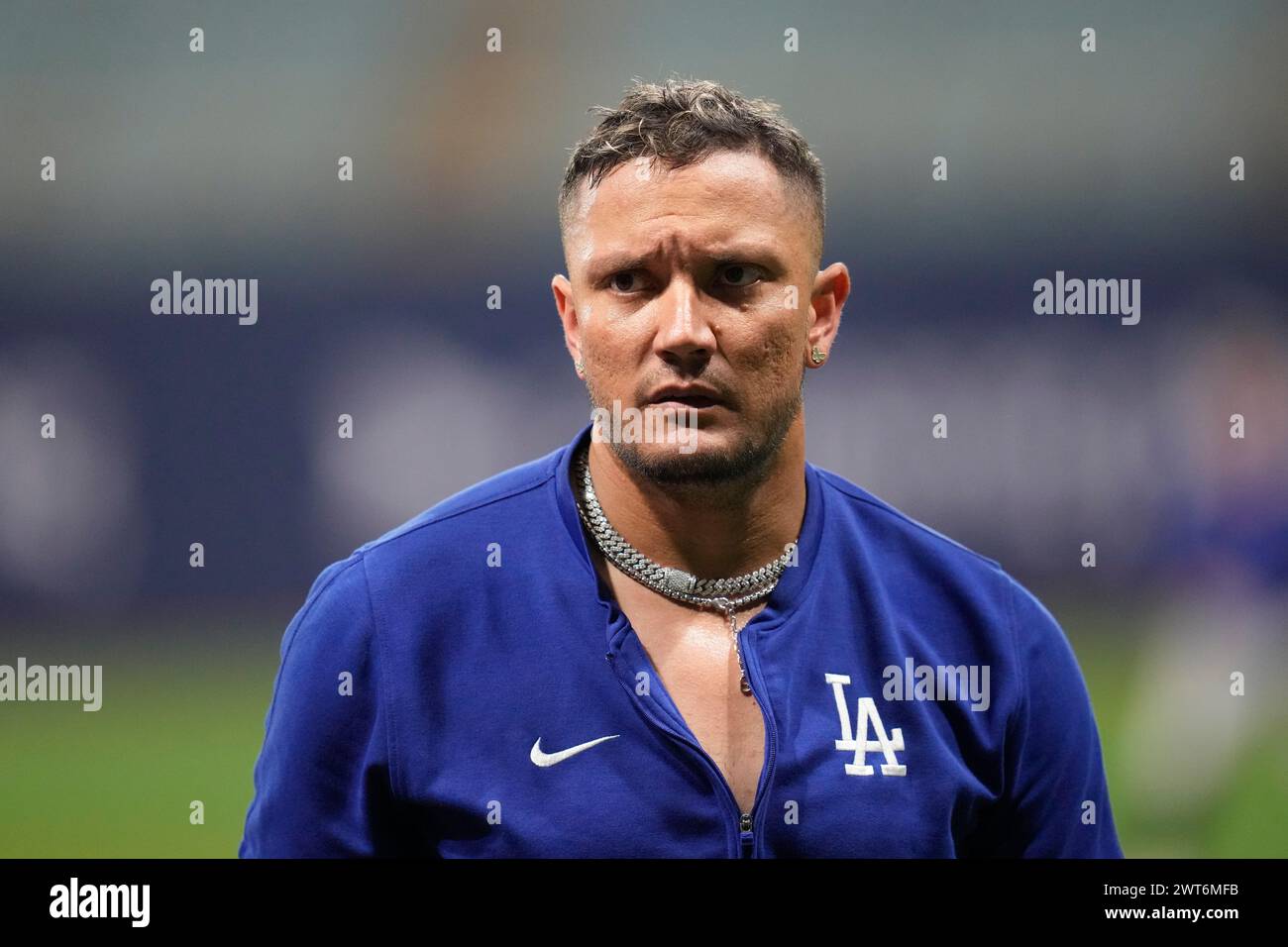 Los Angeles Dodgers' Miguel Rojas looks on during a baseball workout at ...