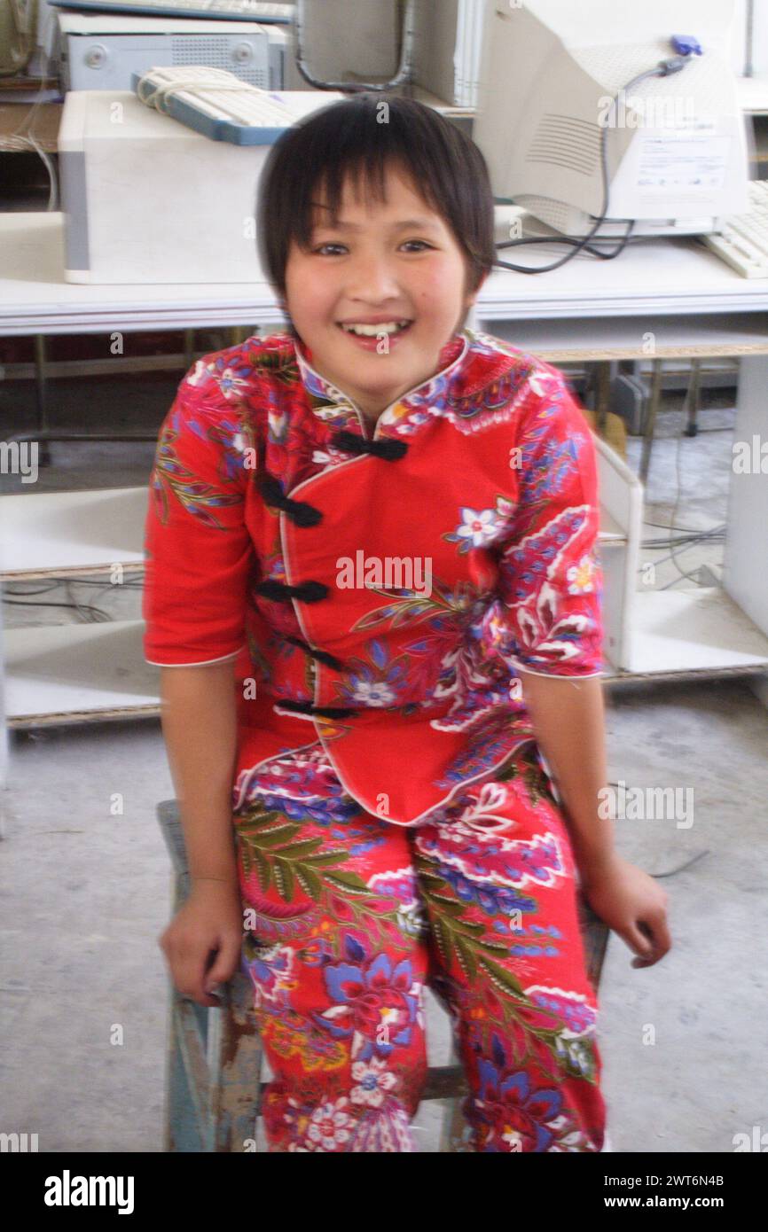 School girl in traditional clothes, computer room, Shanxi Province ...