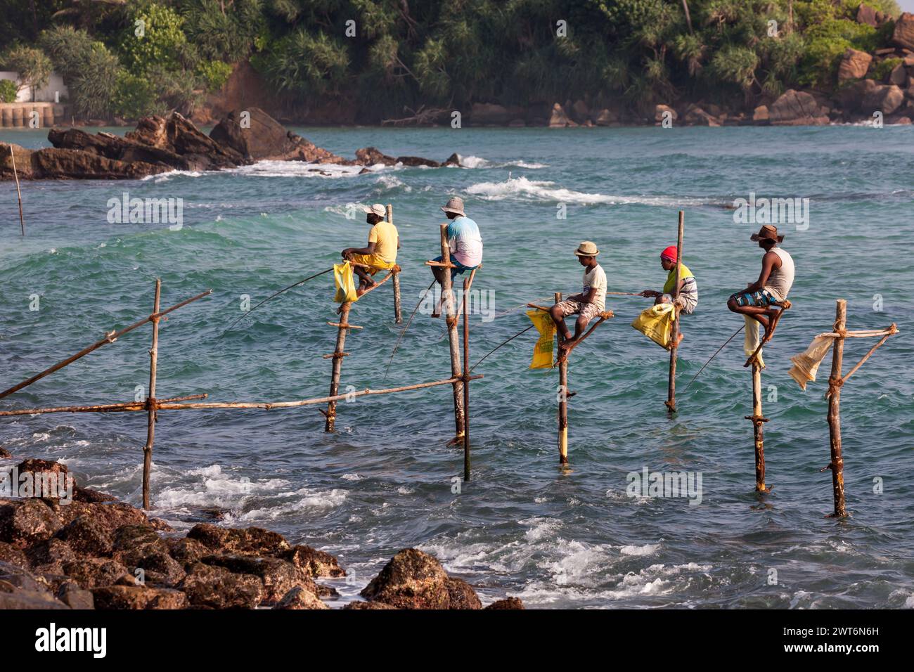 Sri Lanka, Weligama, Stilt fishermen (demonstration), in local language ...