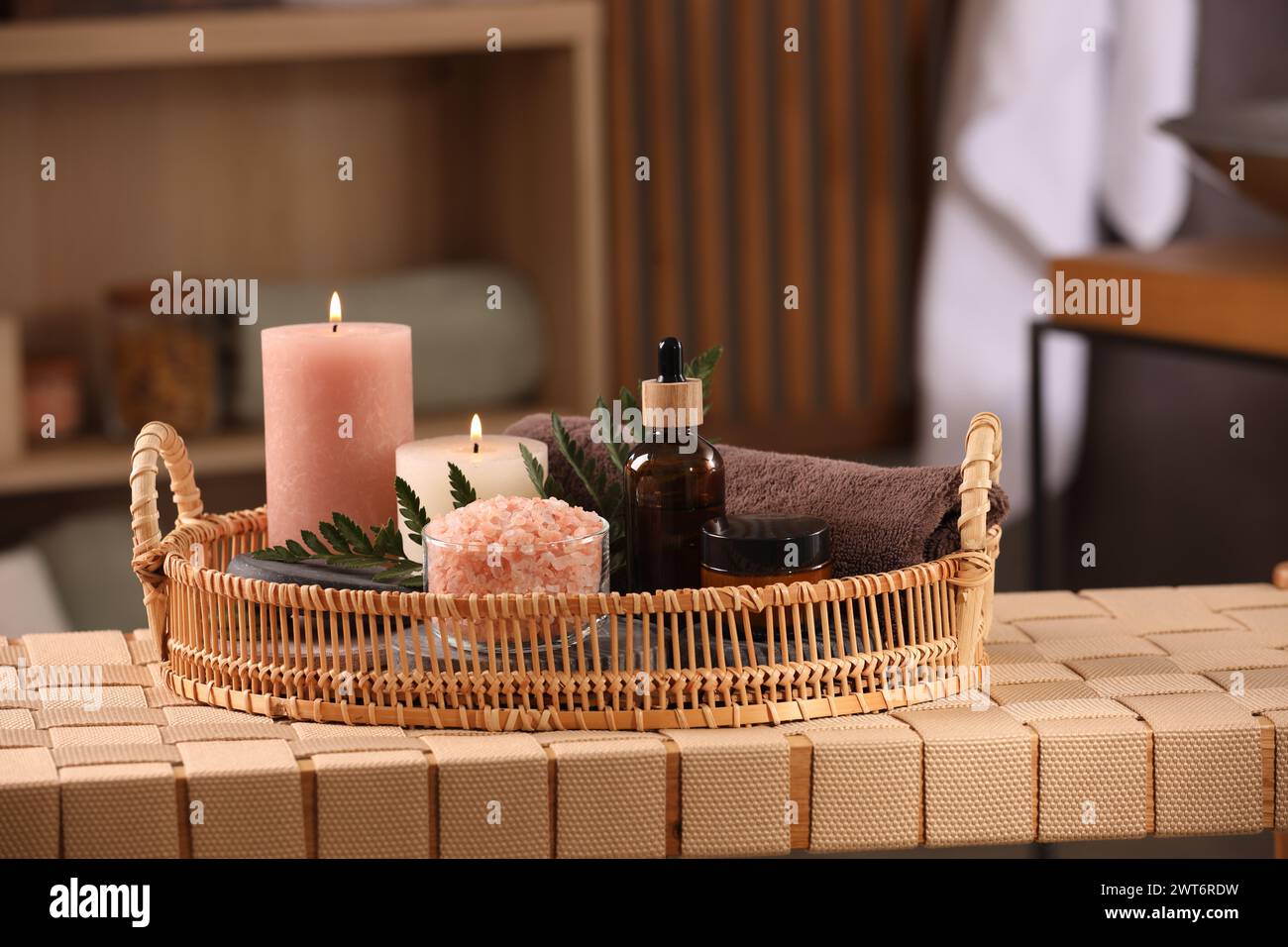 Beautiful composition with different spa products on wicker bench ...