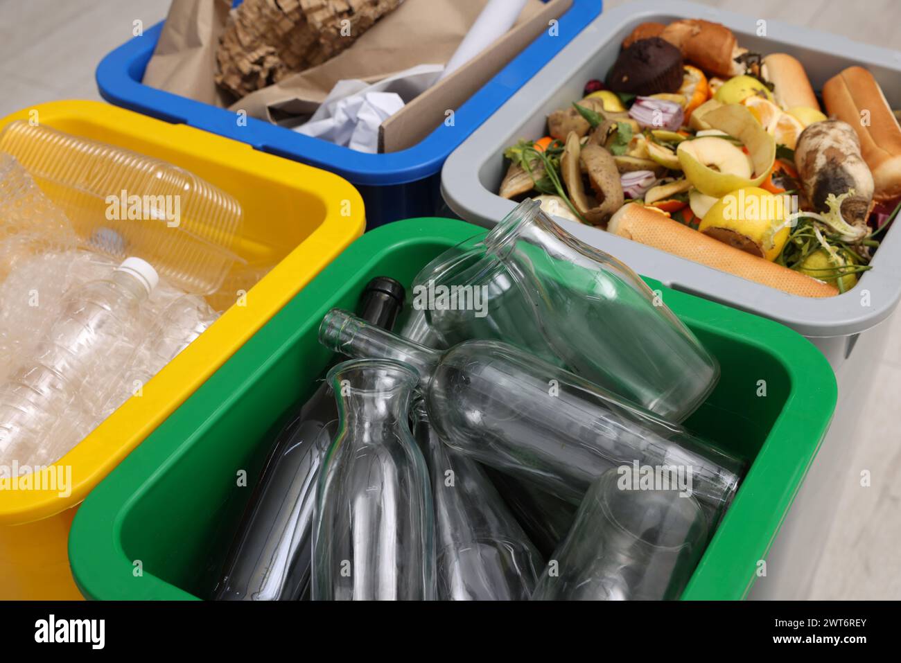 Garbage sorting. Full trash bins for separate waste collection indoors ...