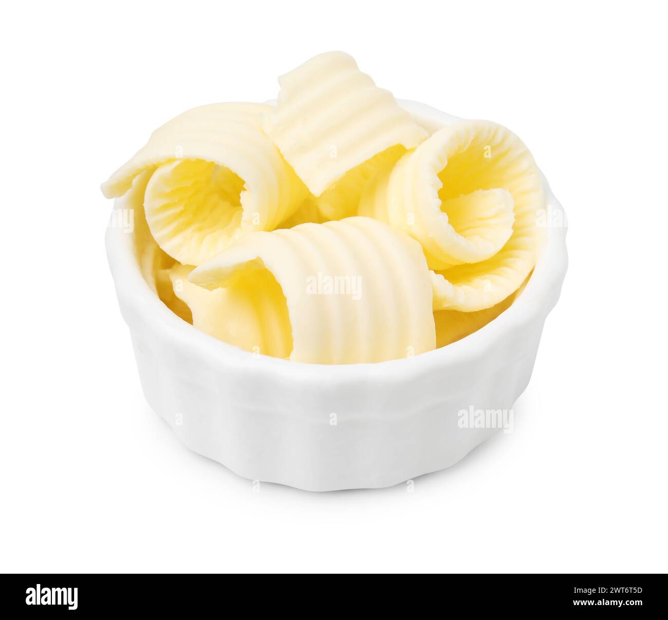 Tasty butter curls in bowl isolated on white Stock Photo - Alamy