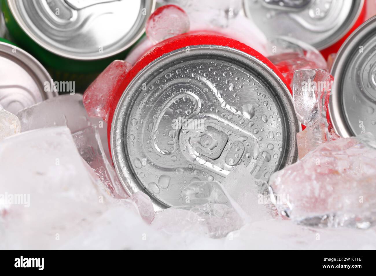 Energy drinks in wet cans and ice cubes, closeup Stock Photo - Alamy