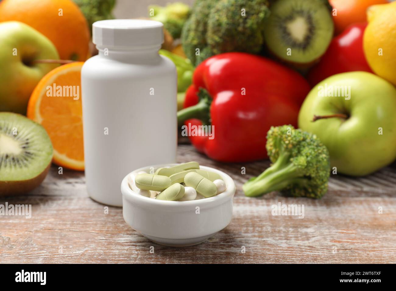 Dietary supplements bottle bowl hi-res stock photography and images - Alamy
