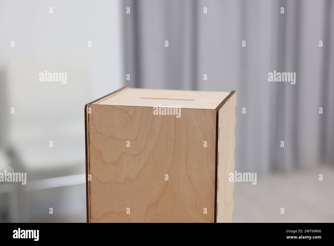 Wooden ballot box on blurred background, closeup Stock Photo - Alamy