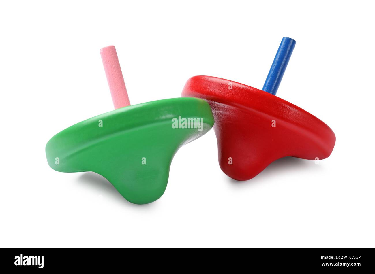 Two bright spinning tops isolated on white Stock Photo - Alamy