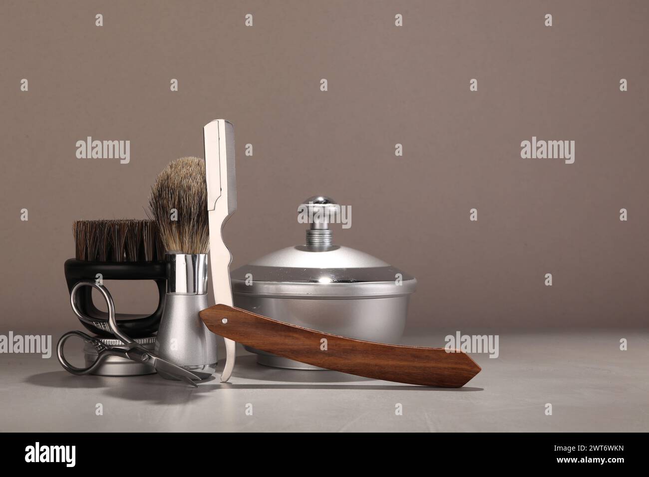 Moustache and beard styling tools on grey table. Space for text Stock ...