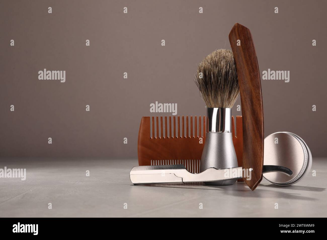 Moustache and beard styling tools on grey table. Space for text Stock ...